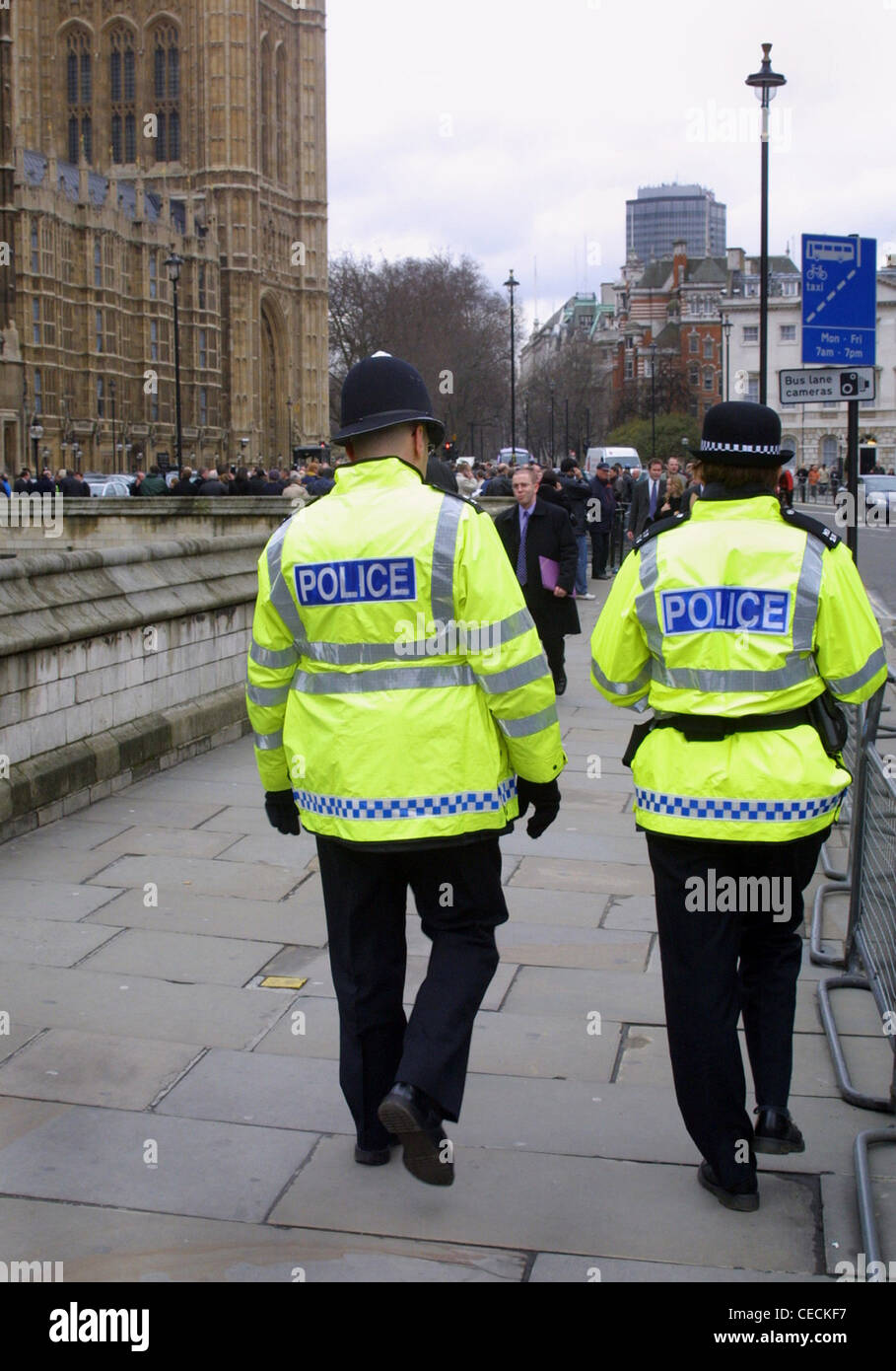 Police Constables patrolling street outside Houses of Parliament ...