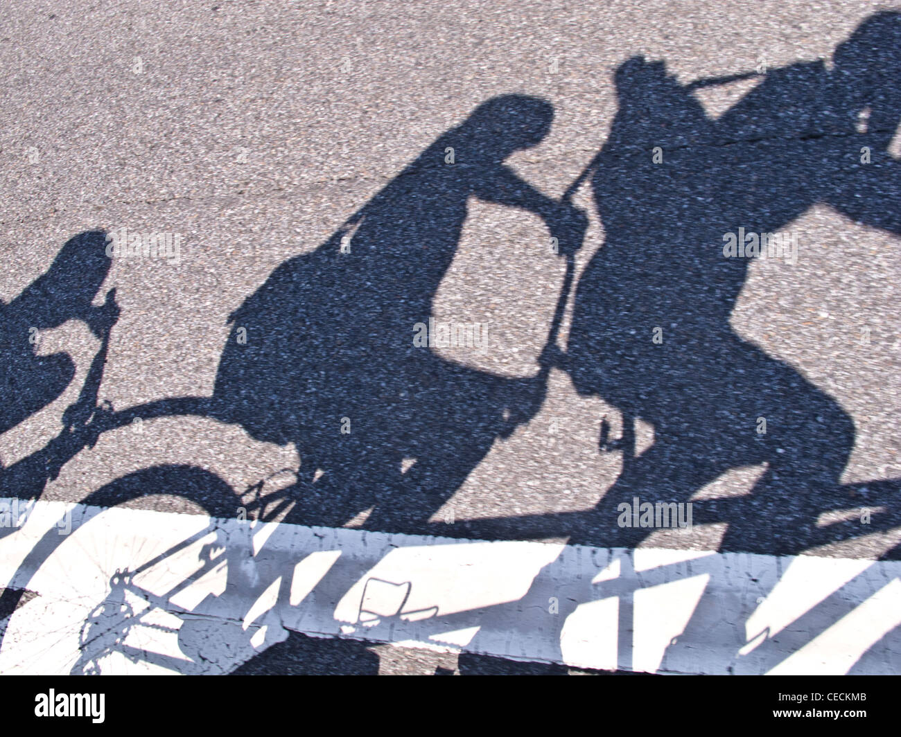 Family on tandem bike - shadow Stock Photo - Alamy