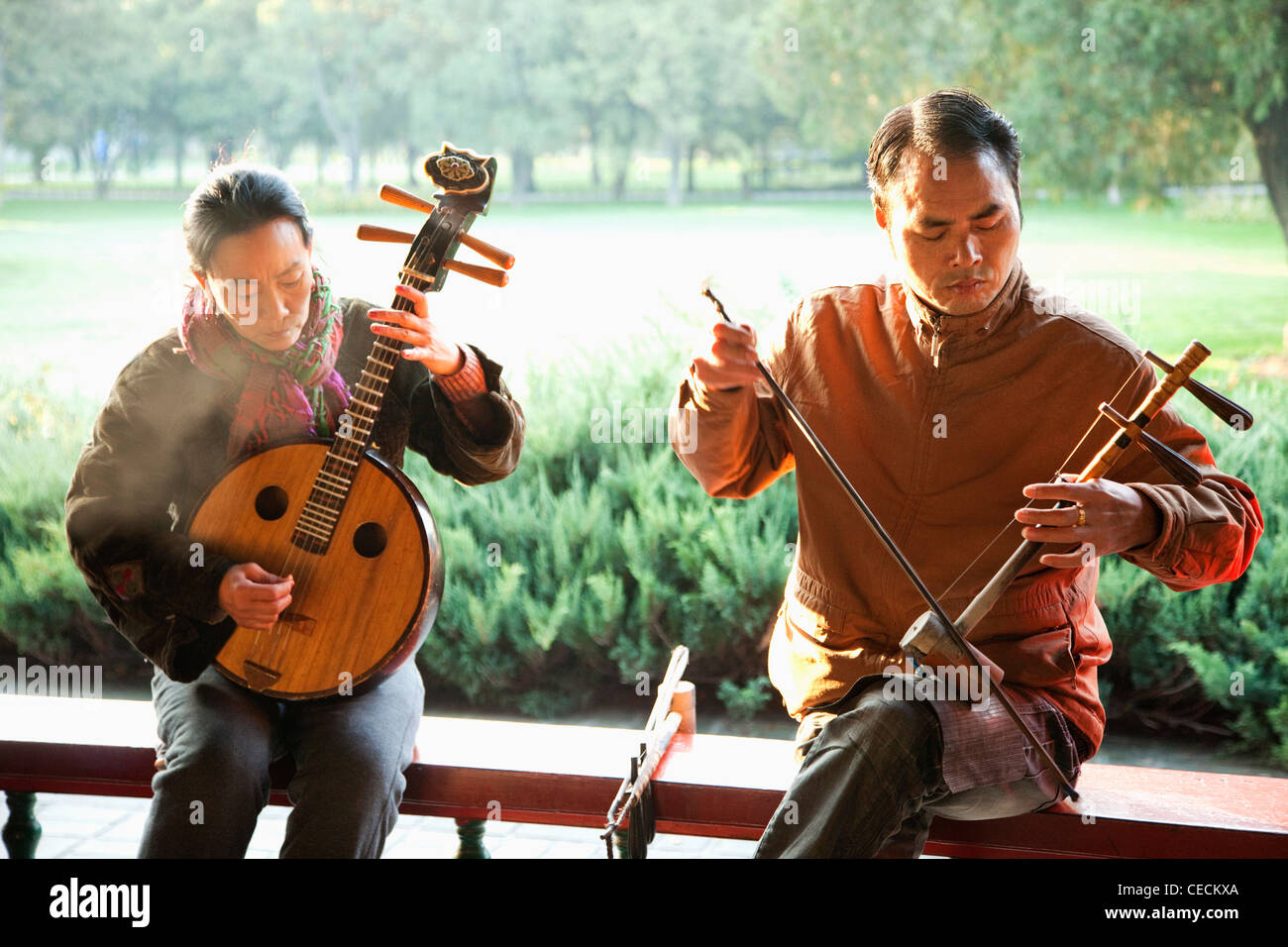 China,Beijing,Temple of Heaven Park, Man and Woman Playing Traditional ...