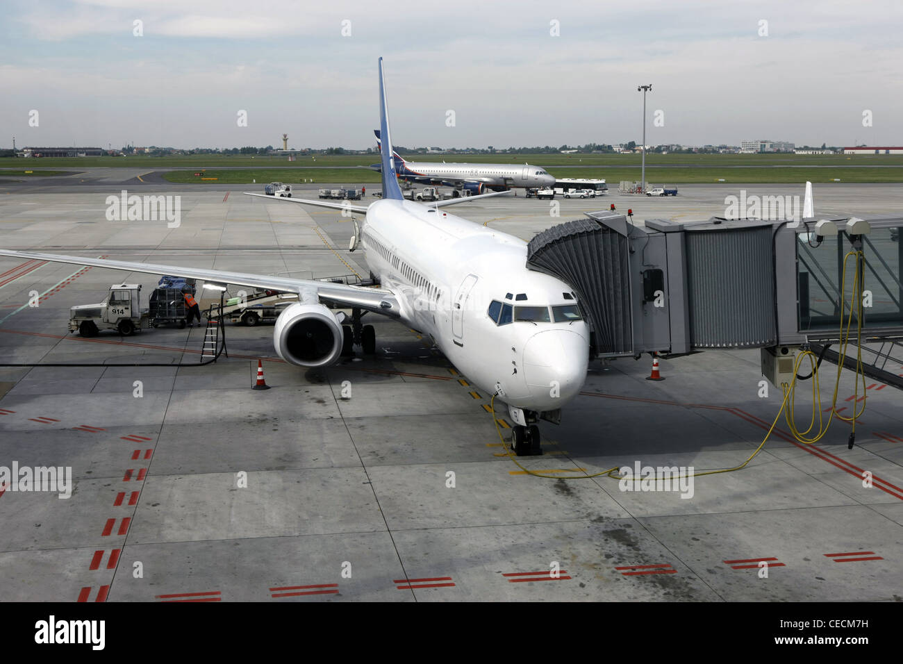 Loading cargo to boeing, service checks the airplane Stock Photo - Alamy