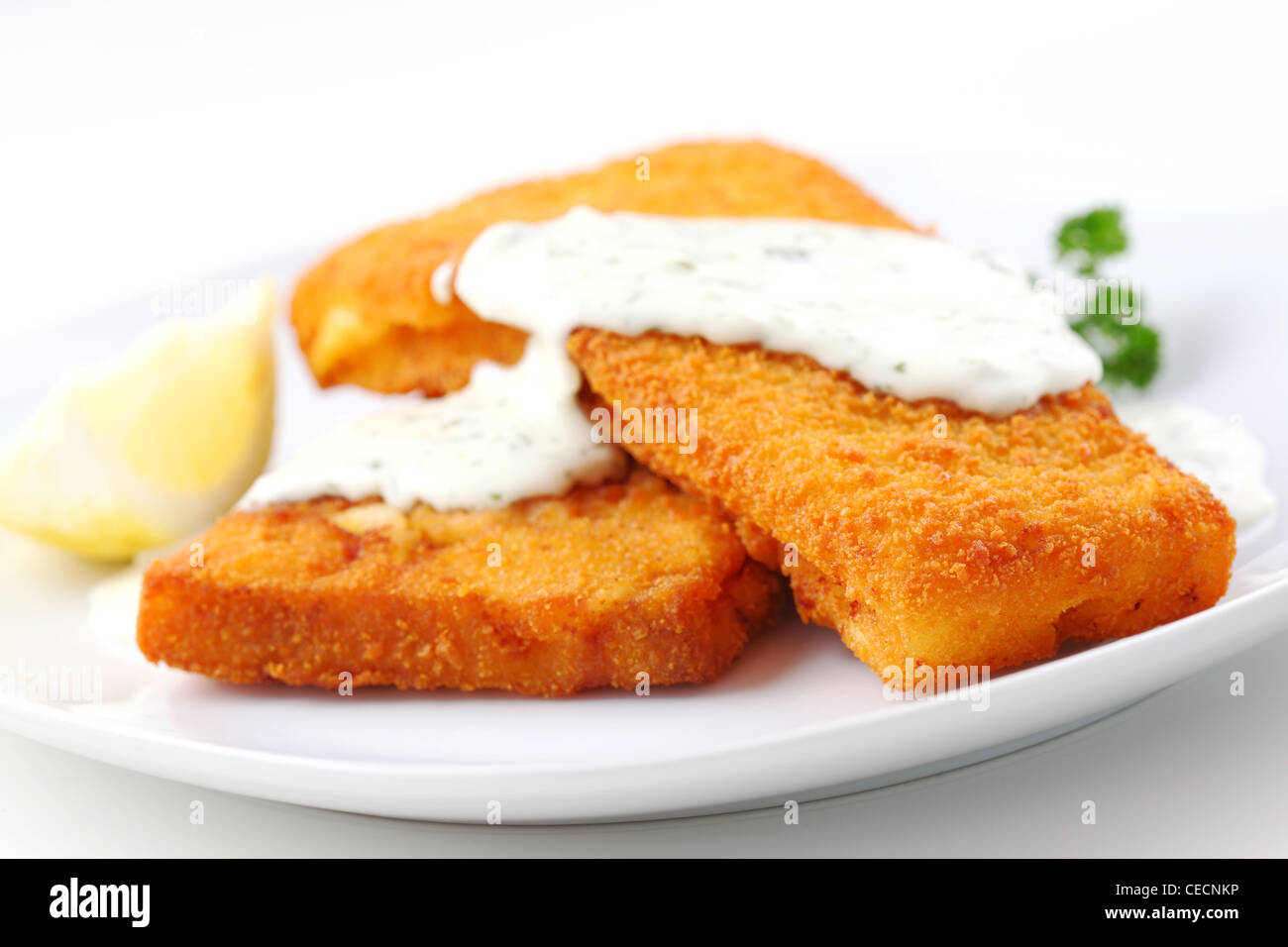 Breaded fish fillet with diet remoulade Stock Photo - Alamy