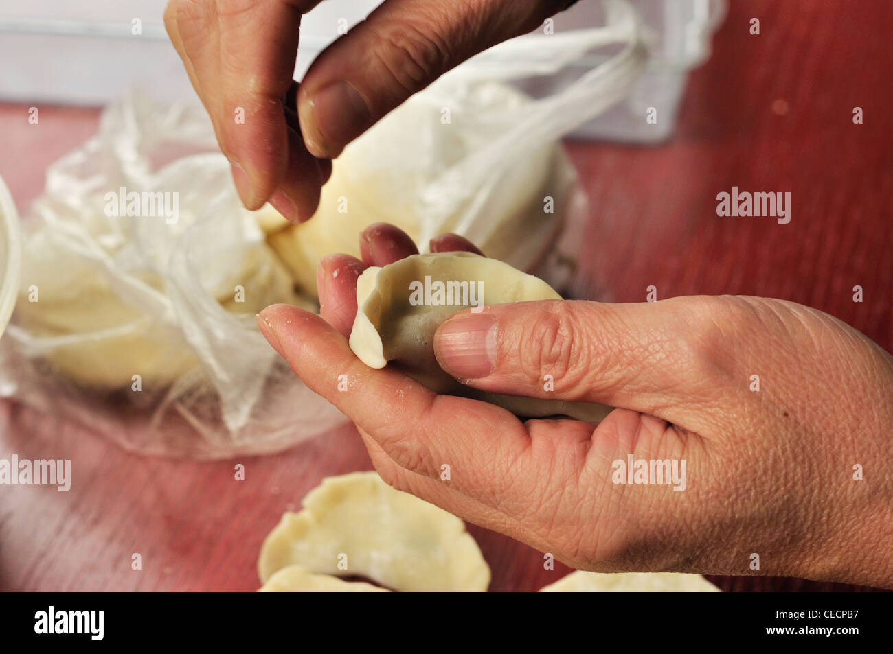 Person making dumplings Stock Photo - Alamy