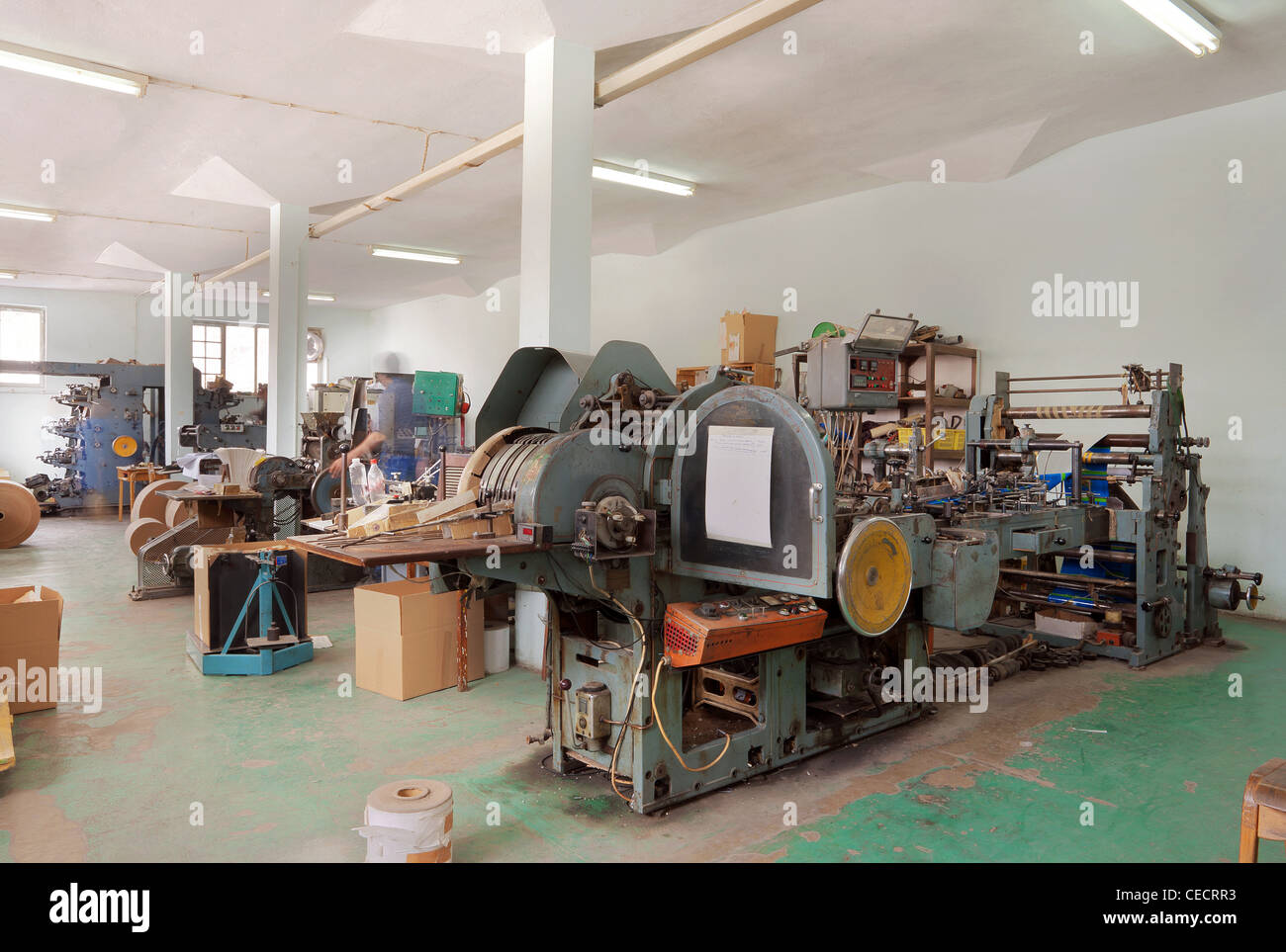 Interior of a factory, old machine for printing Stock Photo - Alamy