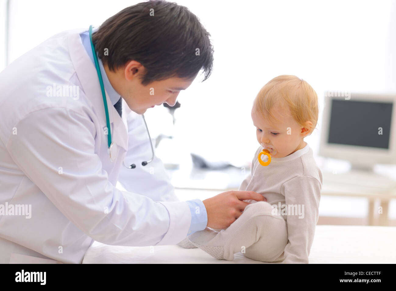 Baby on examination being checked by pediatric doctor Stock Photo - Alamy