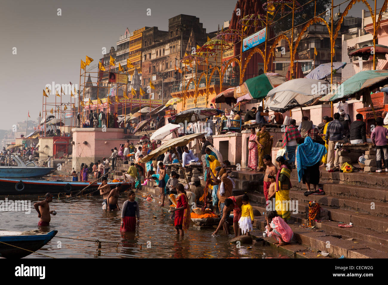 Hindu pilgrims bathing in ganges river in early morning hi-res stock ...