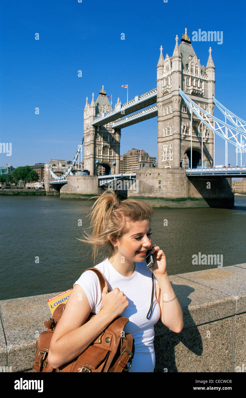 England, London, Female Tourist Talking on Mobile Phone in front of ...