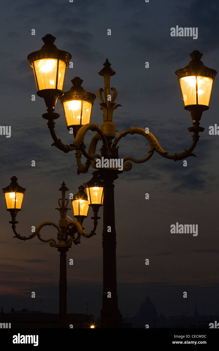 Street lighting at dusk in the city of Rome Italy Stock Photo - Alamy