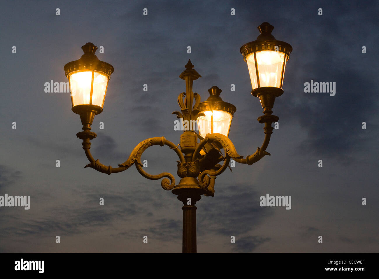 Street lighting at dusk in the city of Rome Italy Stock Photo - Alamy