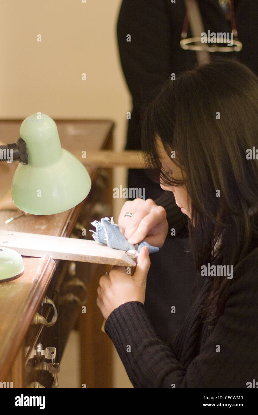 A Skilled worker making a Cameo jewel method of carving an object such ...