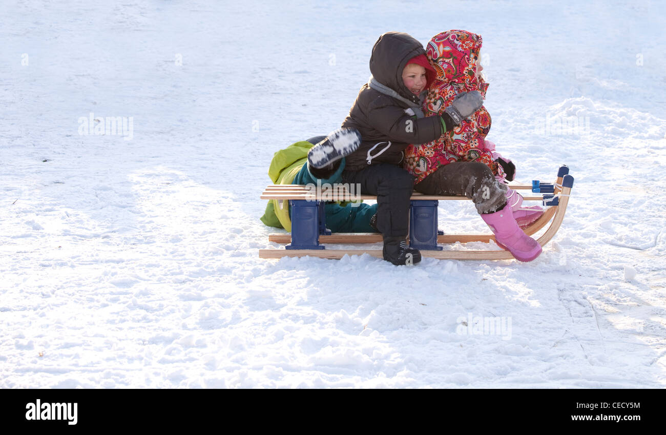 Kids riding on sleigh hi-res stock photography and images - Alamy