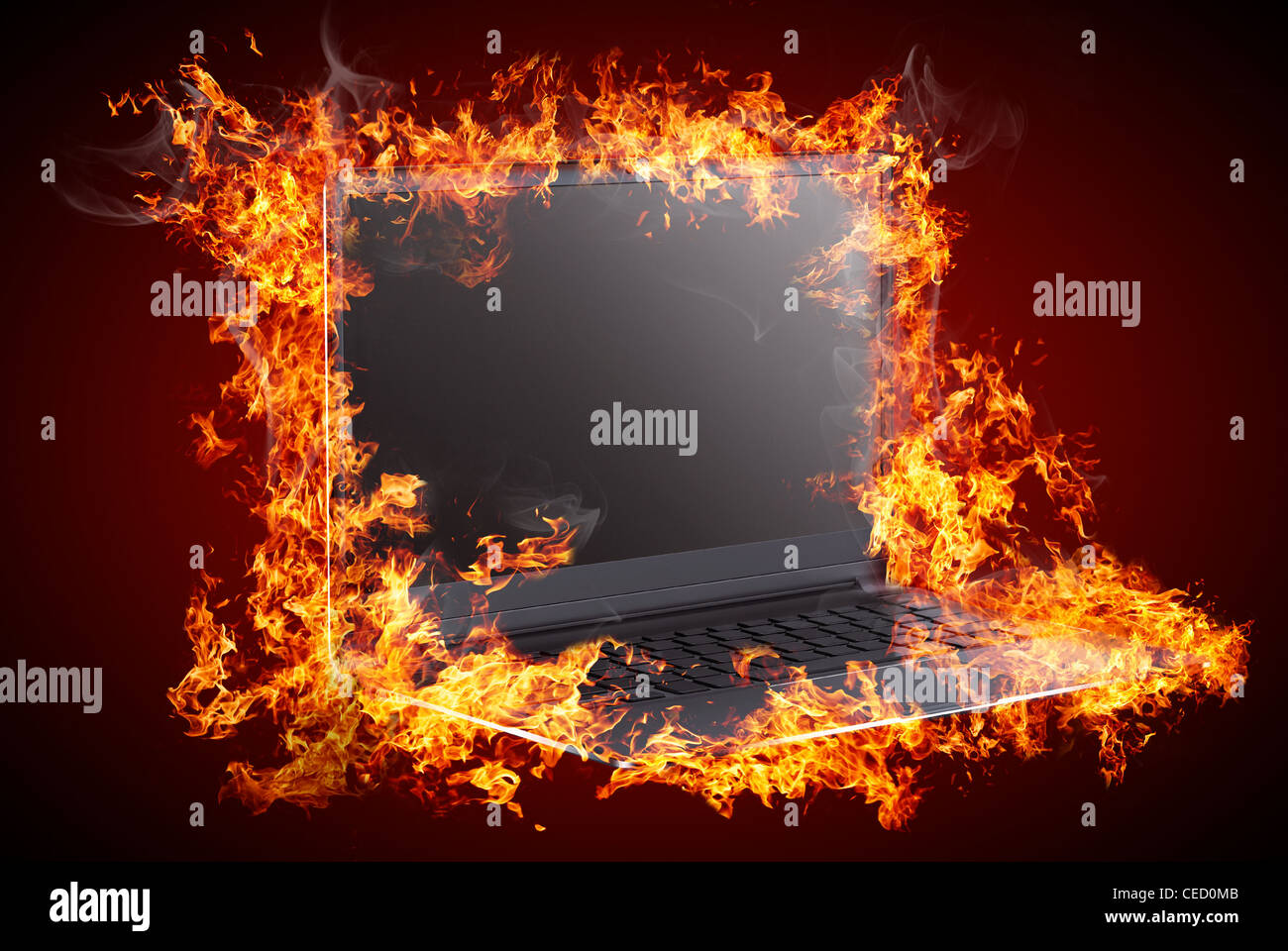 Computer in fire Stock Photo - Alamy