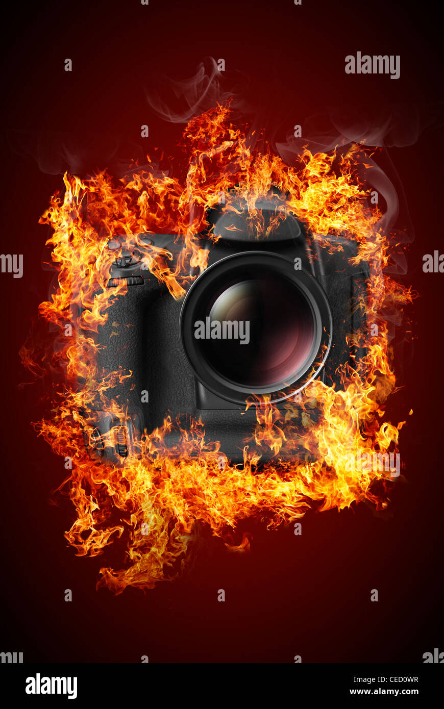 Photo camera with no labels or trademarks on fire Stock Photo - Alamy
