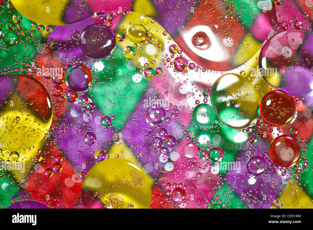 Harlequin pattern with abstract bubbles of oil, oil on water, clear oil ...