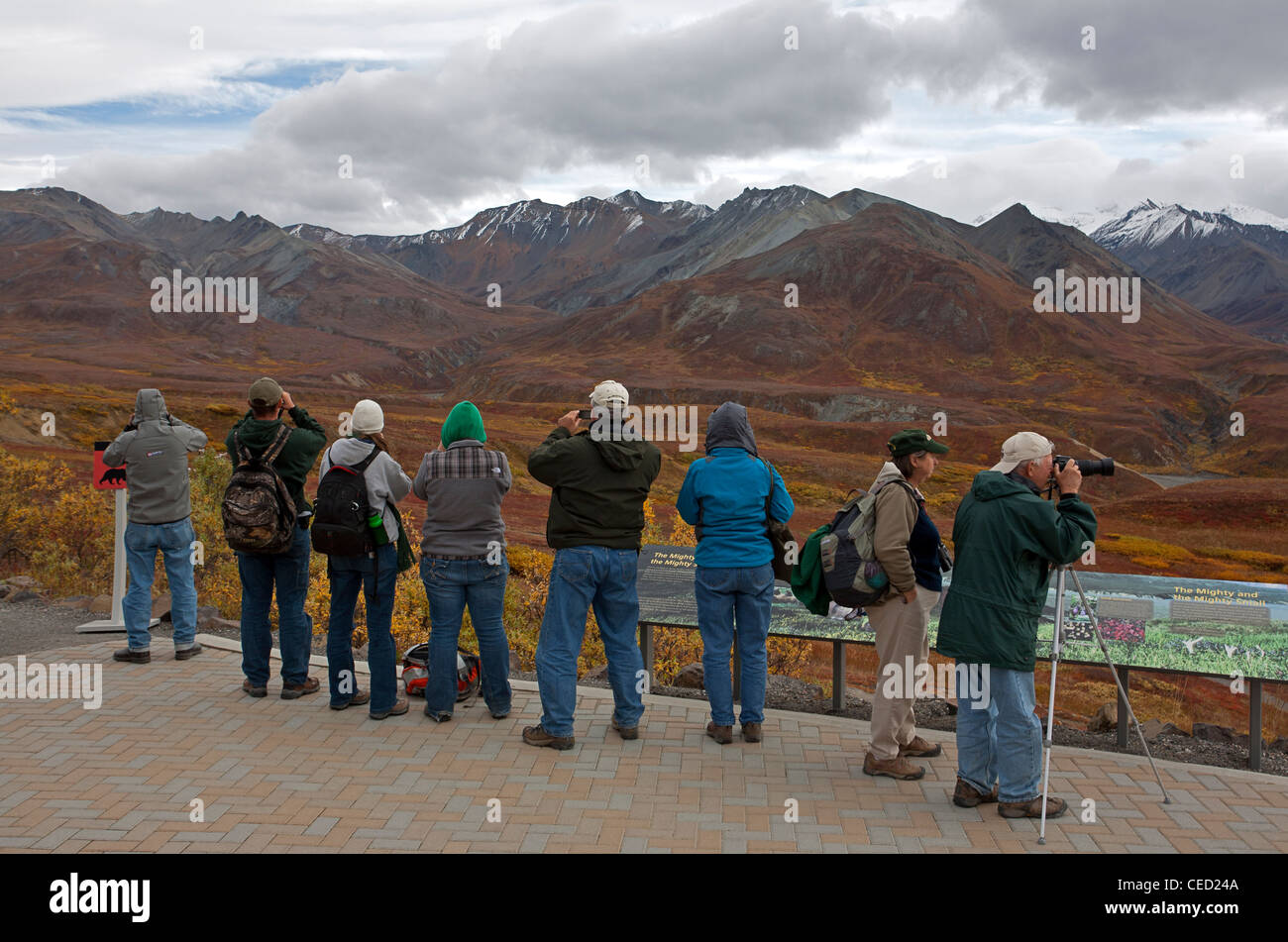 Tourists photographing the landscape. Eielson Visitor Center. Denali ...