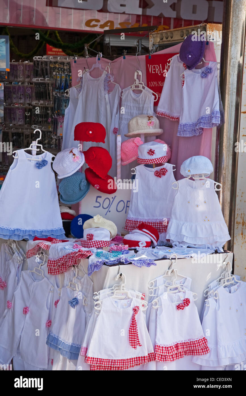 Childrens cloths on stall with reduced prices Stock Photo - Alamy