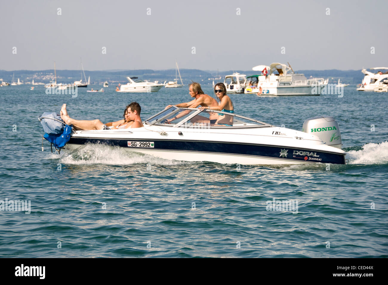 Sunbathing on a speedboat hi-res stock photography and images - Alamy