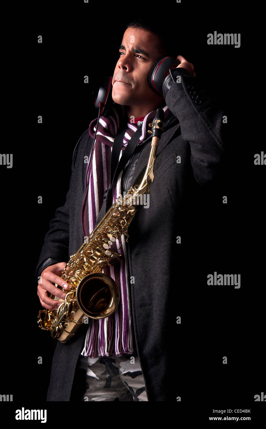 Stylish man playing the saxophone Stock Photo - Alamy
