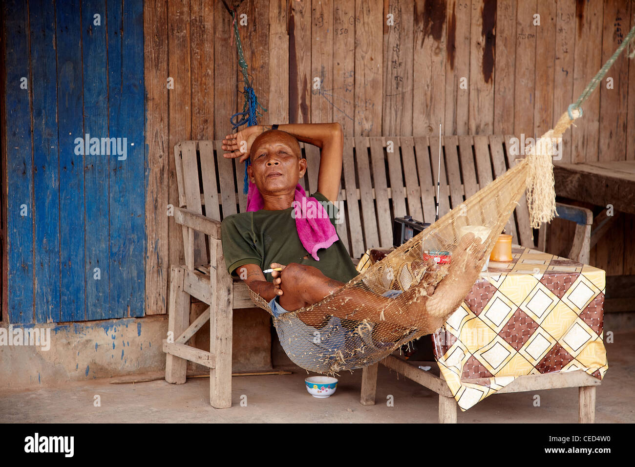Cambodian man smoking cigarette hi-res stock photography and images - Alamy