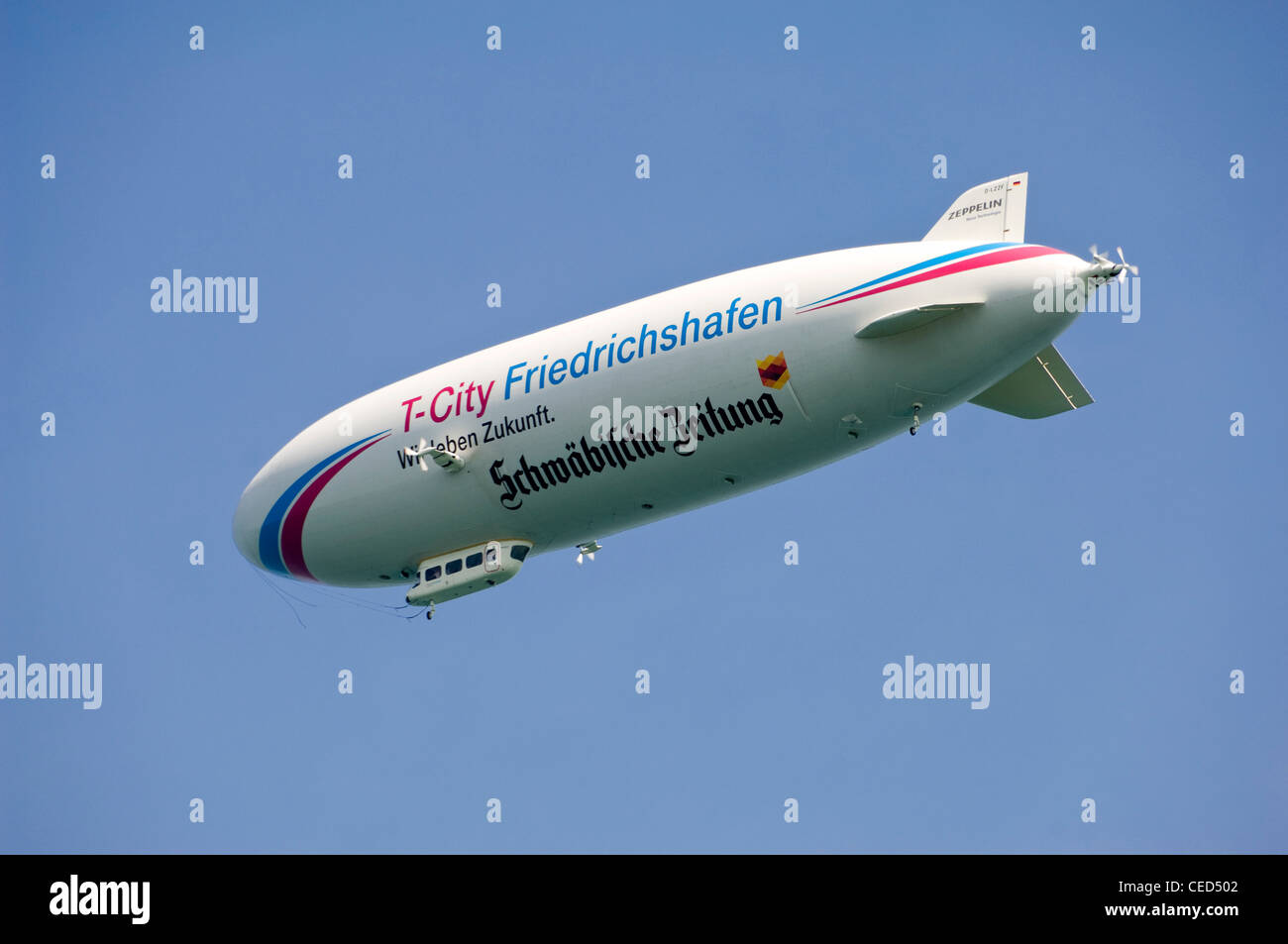 Horizontal close up of a large airship floating in a blue sky Stock ...