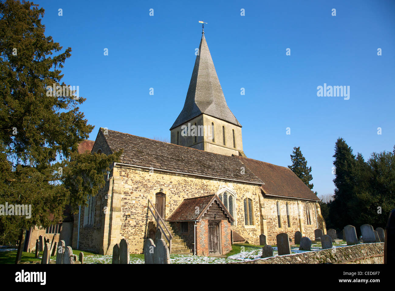 St James Church, Shere, Surrey on the banks of the River Tillingbourne ...