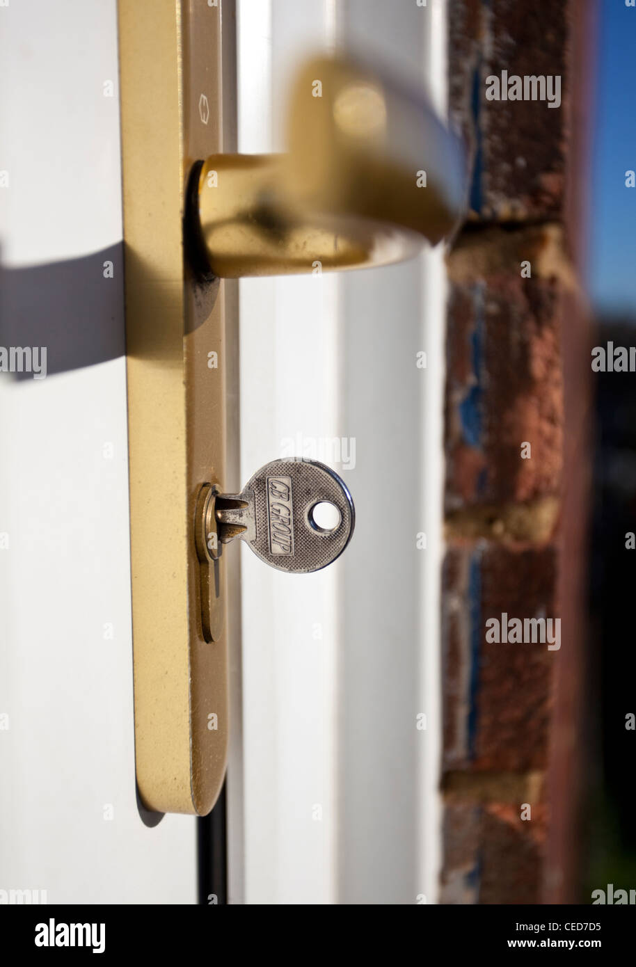 Key inserted in door lock Stock Photo - Alamy