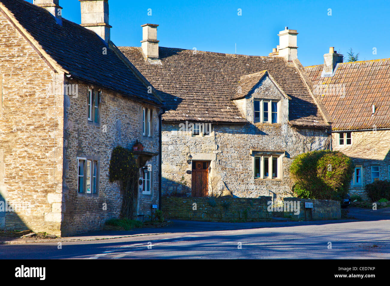 Typical Cotswold stone houses along the road through the English ...