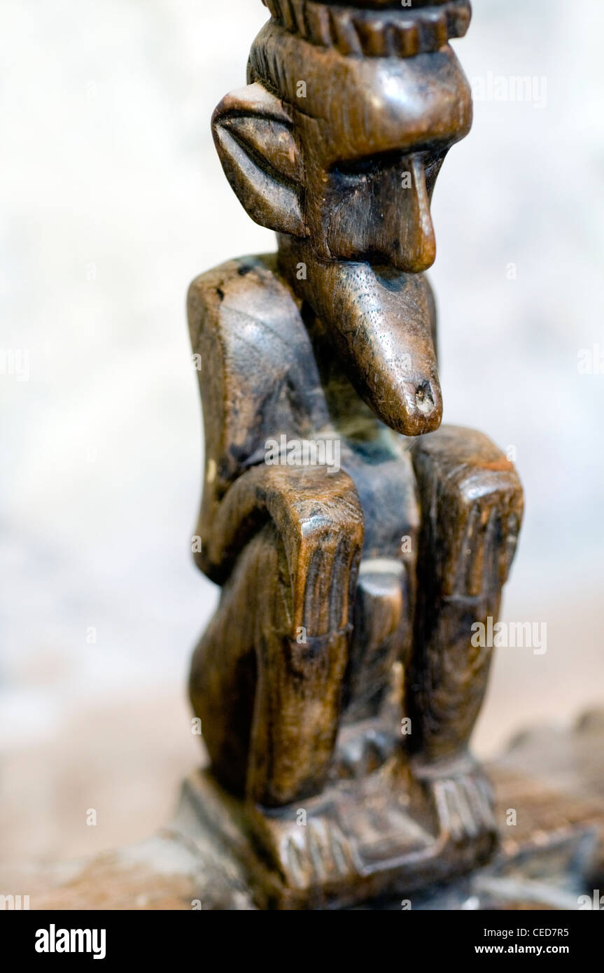 Carved Wooden Male Figure Seated Stock Photo - Alamy