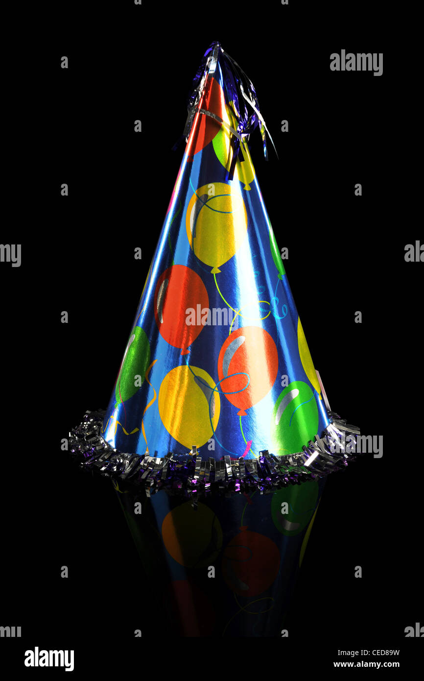 Shiny party hat isolated over black background with reflection Stock ...