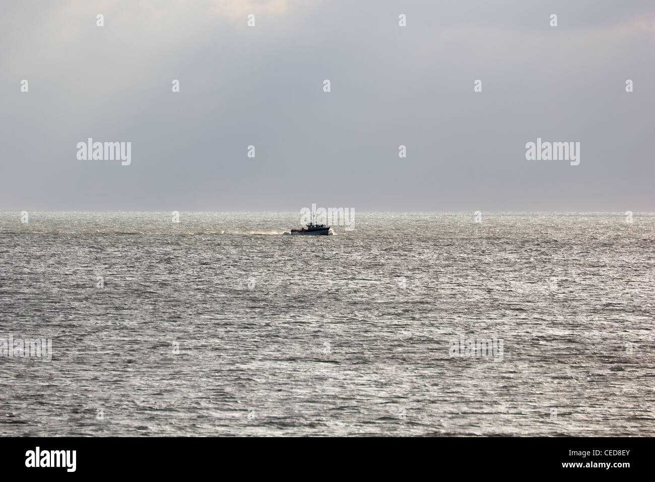 Littlehampton - coast and beach with a boat at sea Stock Photo - Alamy