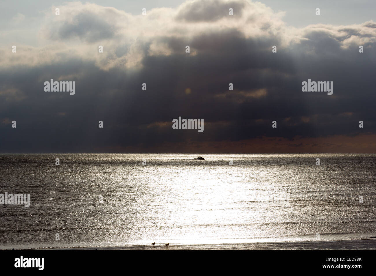 Littlehampton - coast and beach with the sun reflecting off the sea ...