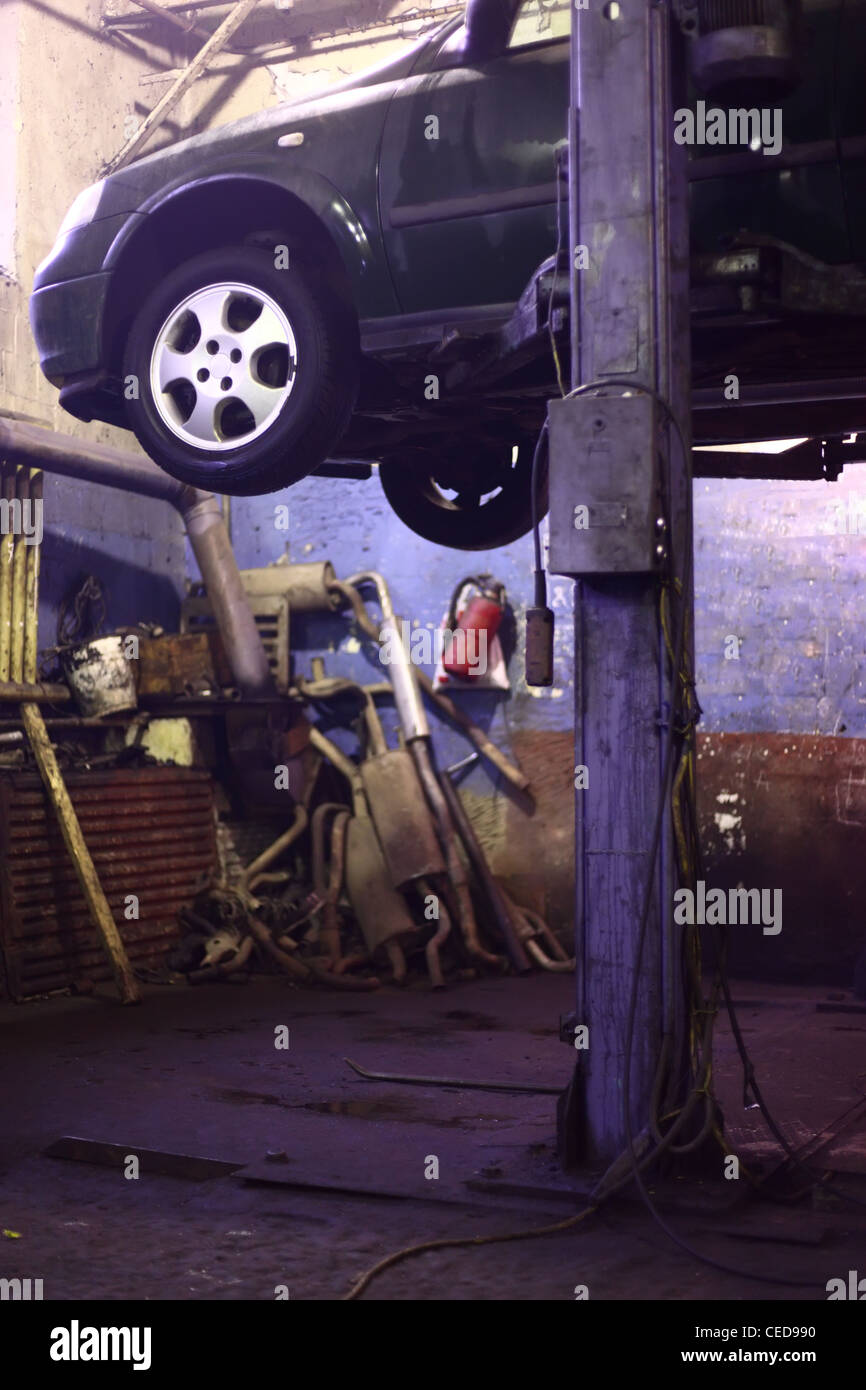Car on lift repair hi-res stock photography and images - Alamy