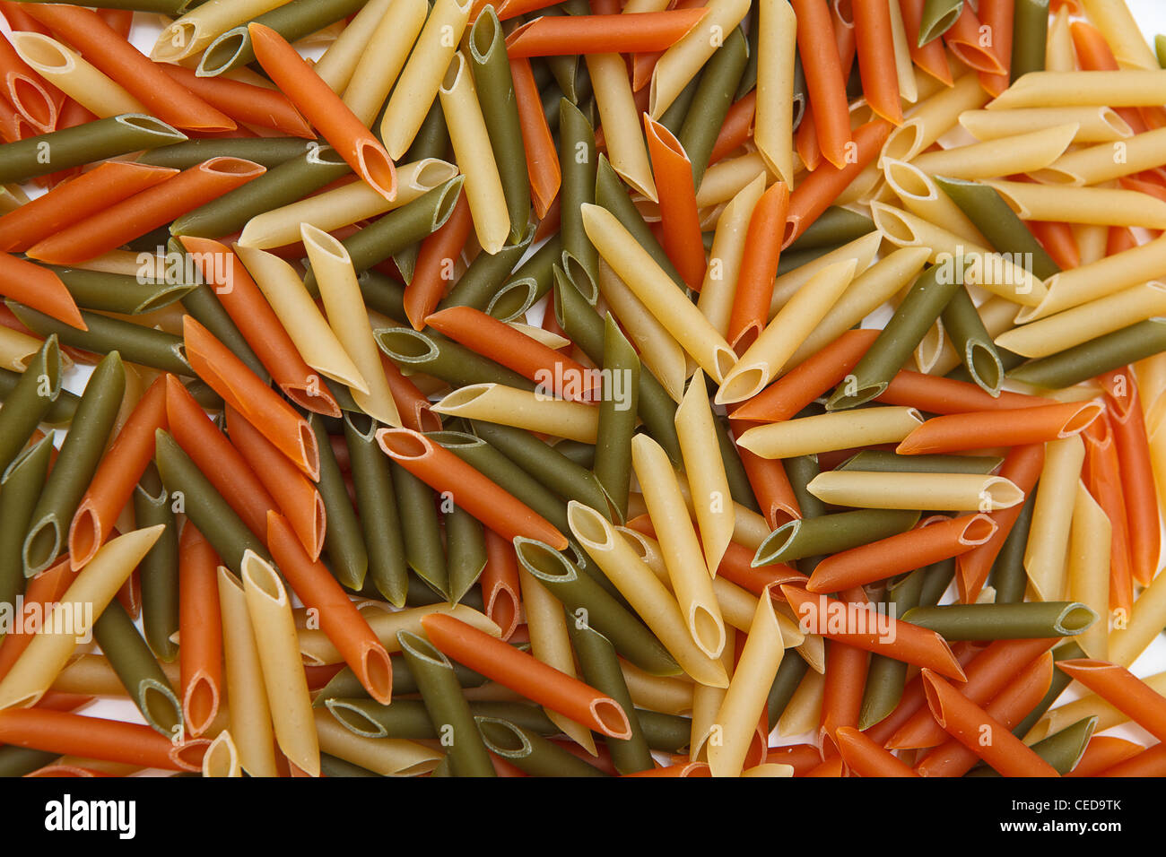 Colorful dry macaroni in background Stock Photo - Alamy