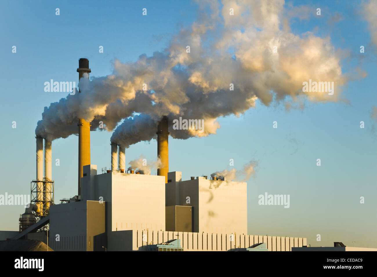 Smoke, industrial pollution and smog in the air on sunny and freezing ...