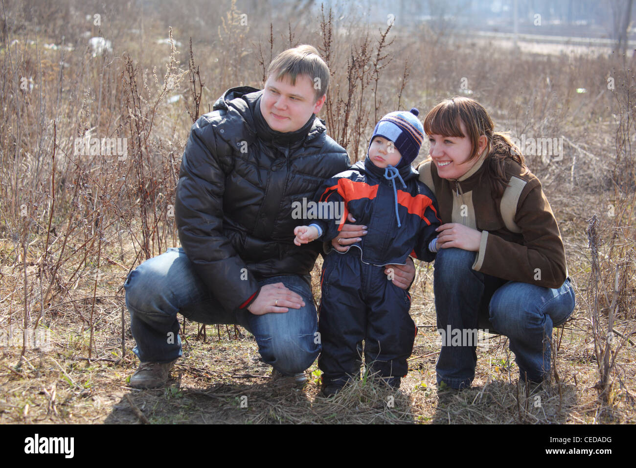 Parents with child outdoor in spring Stock Photo - Alamy