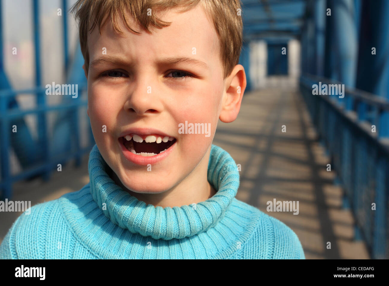 Shouting boy on bridge Stock Photo - Alamy