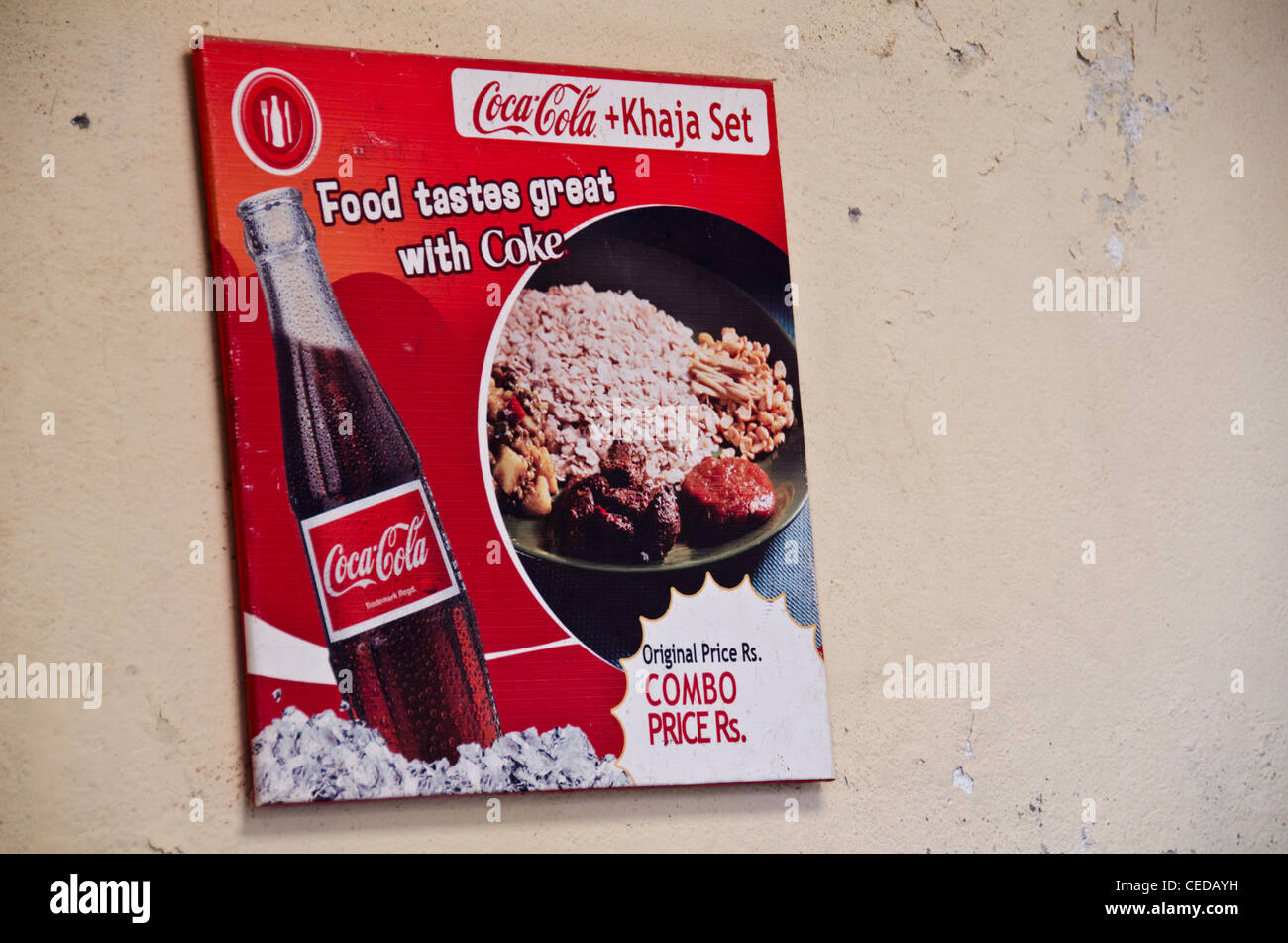 Coke being advertised with Nepali ethnic foods Stock Photo - Alamy