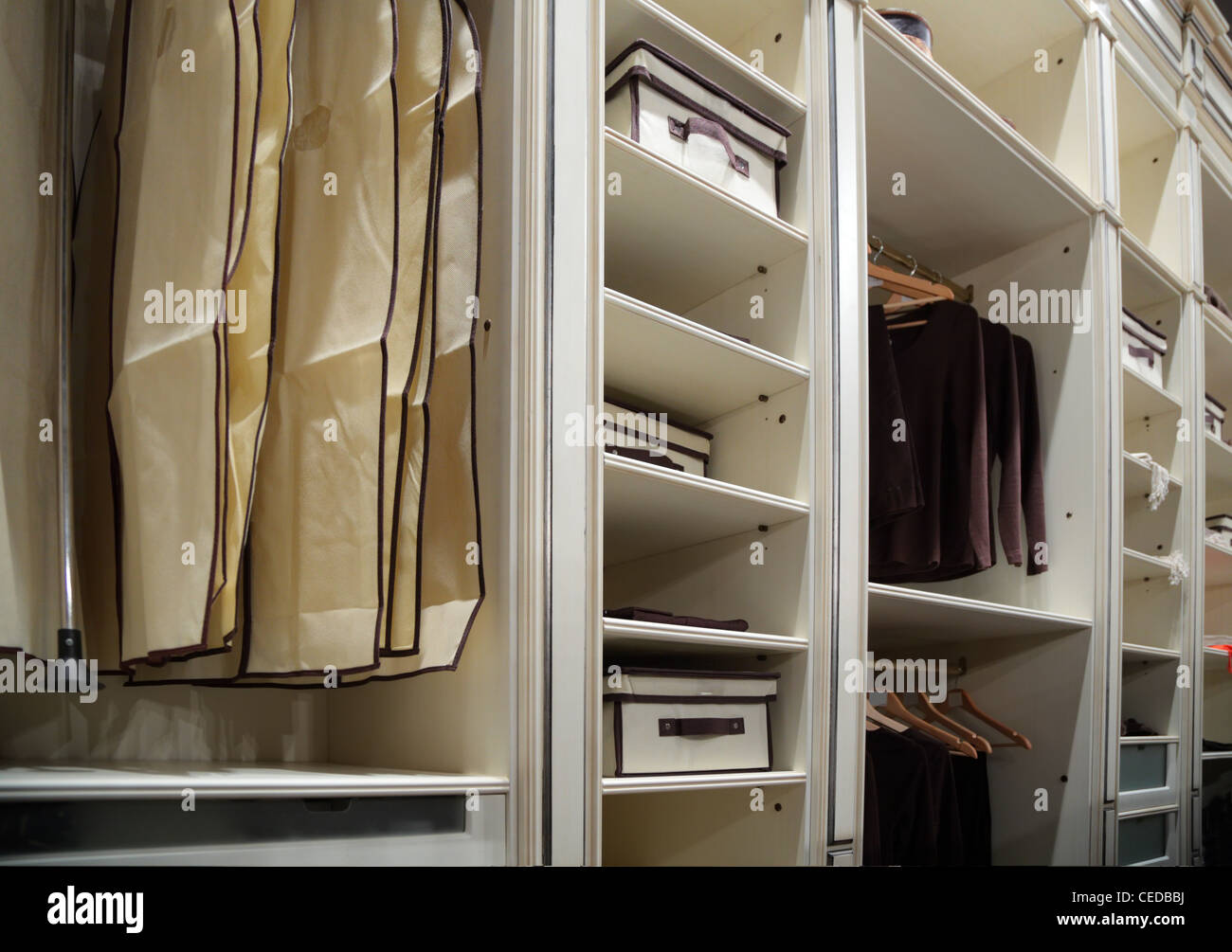 Clothes in wardrobe Stock Photo - Alamy