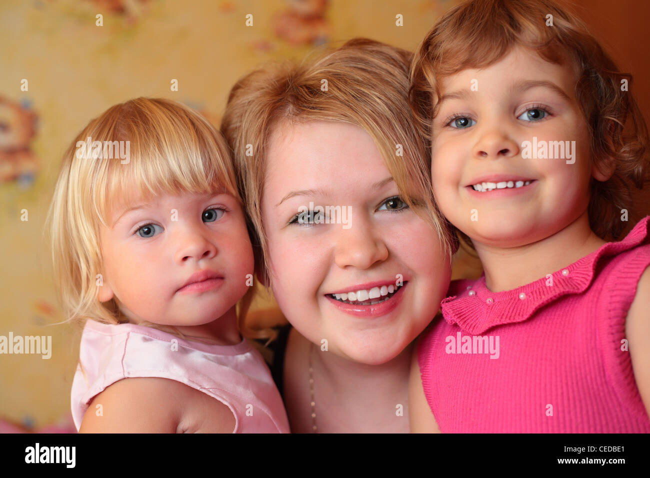 girl with two children Stock Photo - Alamy