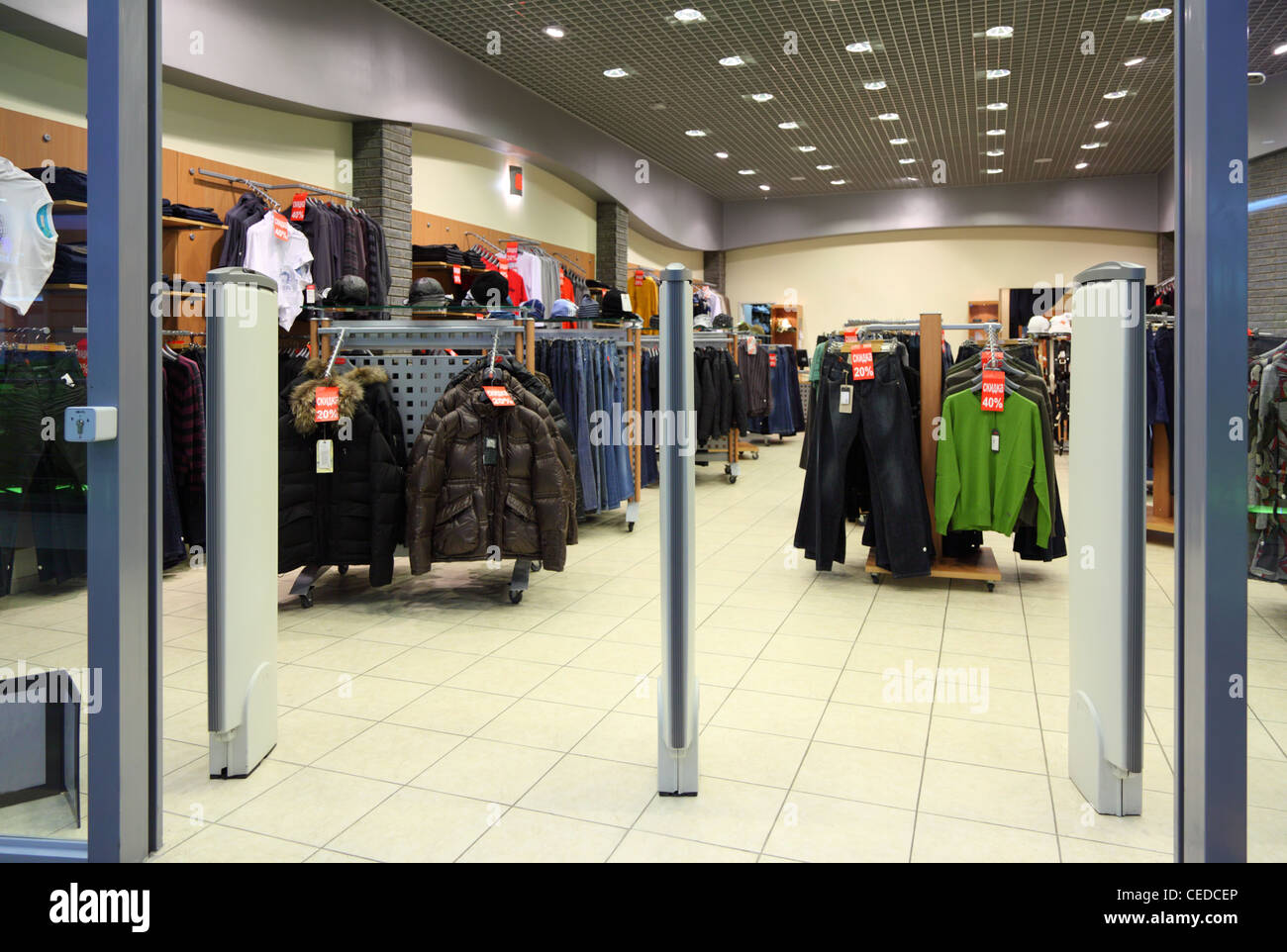 Entrance in clothes section in store, focus on gate Stock Photo - Alamy