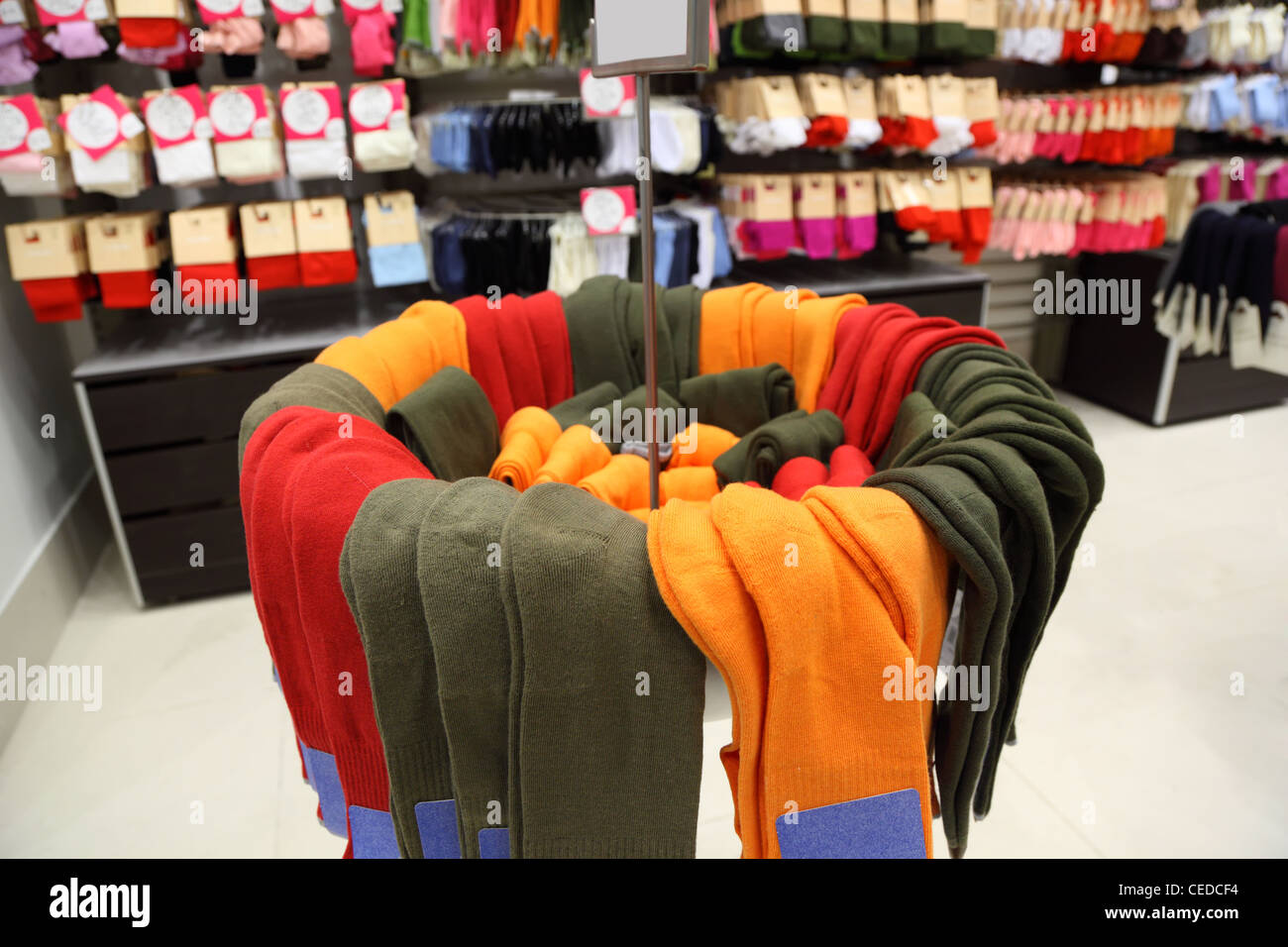 Shelves and racks with socks in shop Stock Photo - Alamy