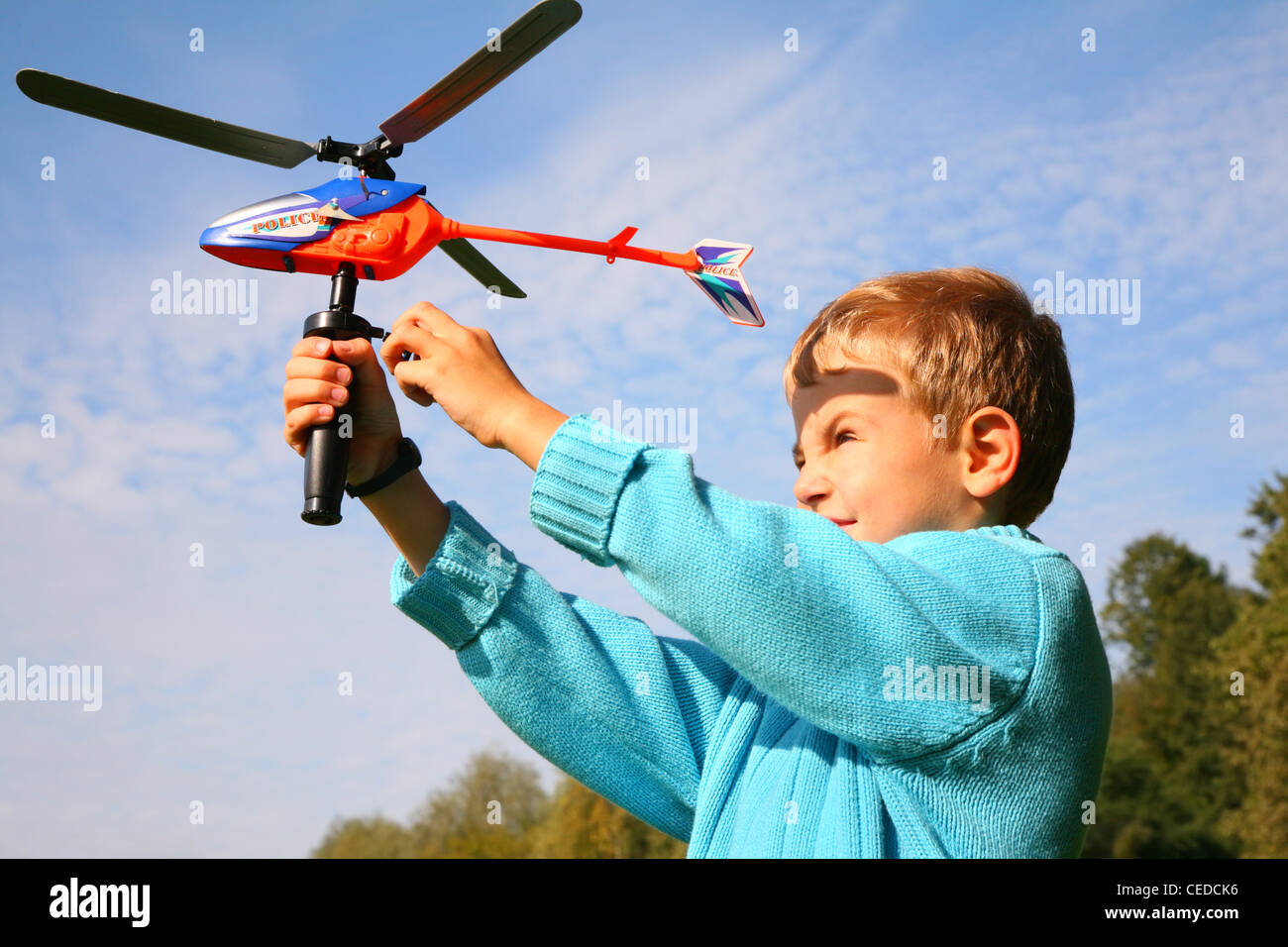 boy starts toy helicopter Stock Photo - Alamy