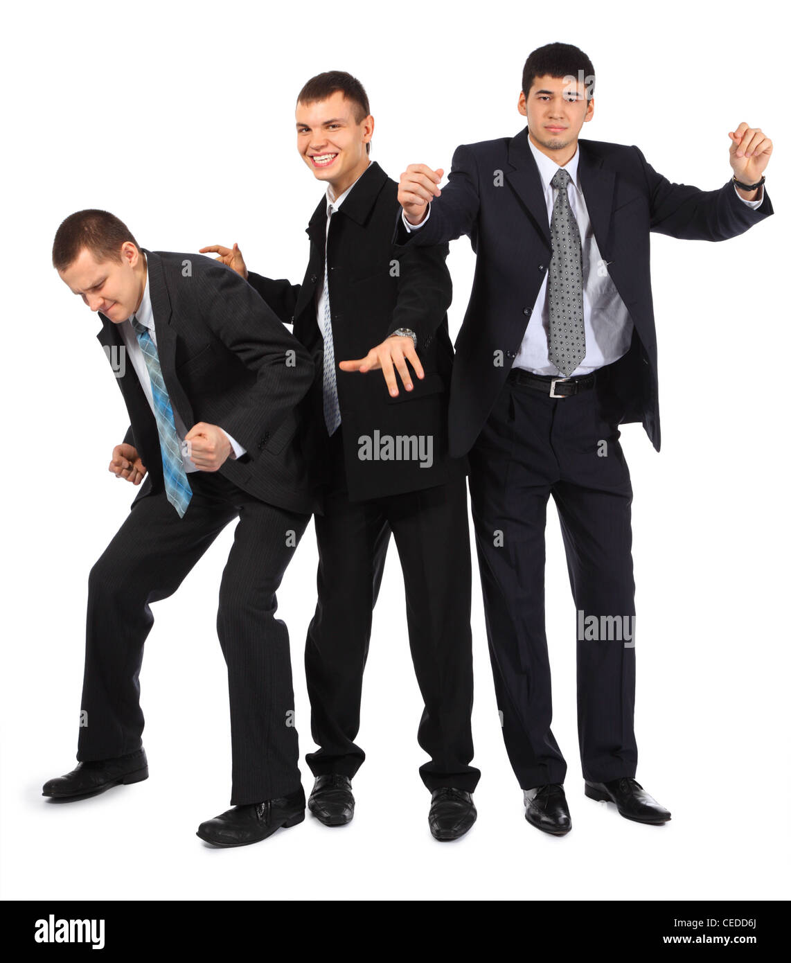 Cheerful three young dancing businessmen Stock Photo - Alamy