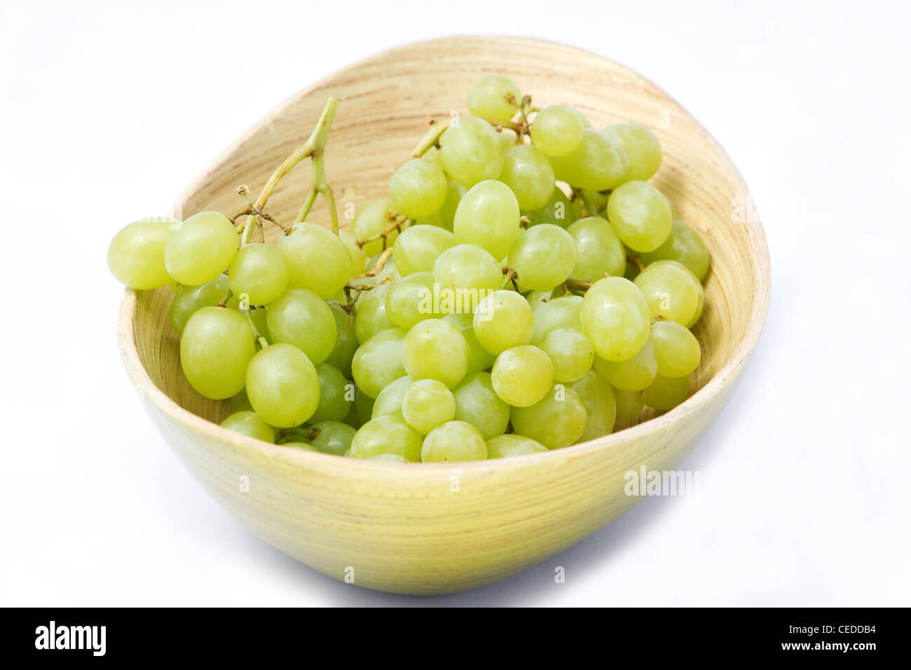 Close-up of white grapes on white background Stock Photo - Alamy