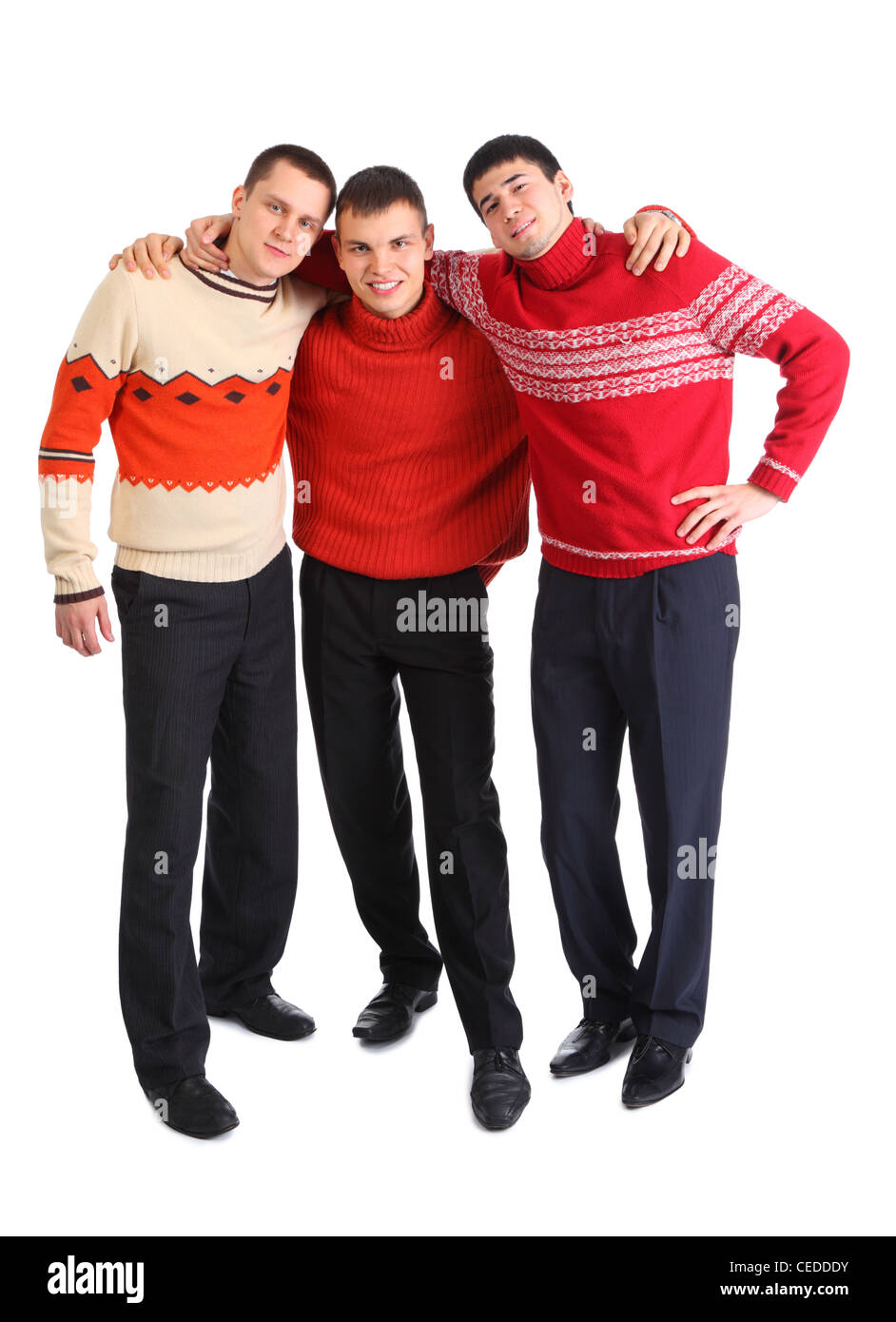 Three friends stand having embraced Stock Photo - Alamy