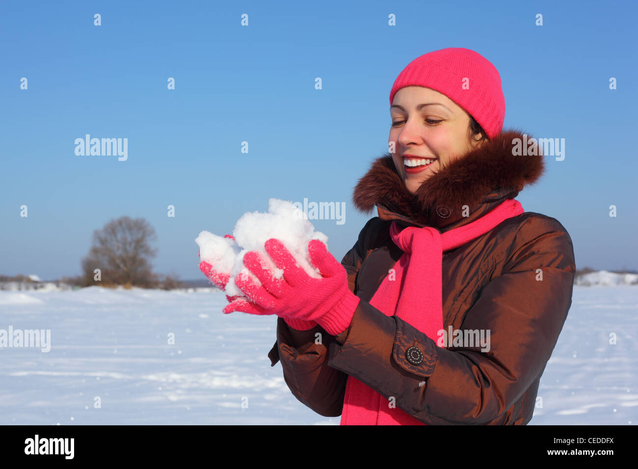 young beauty girl outdoor in winter holds snow in hands Stock Photo - Alamy