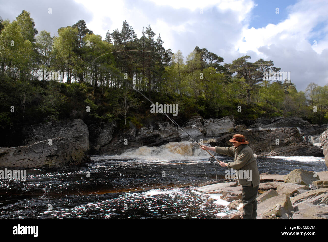 Woman salmon fishing in the River Oykel, Sutherland, Scotland, UK Stock ...