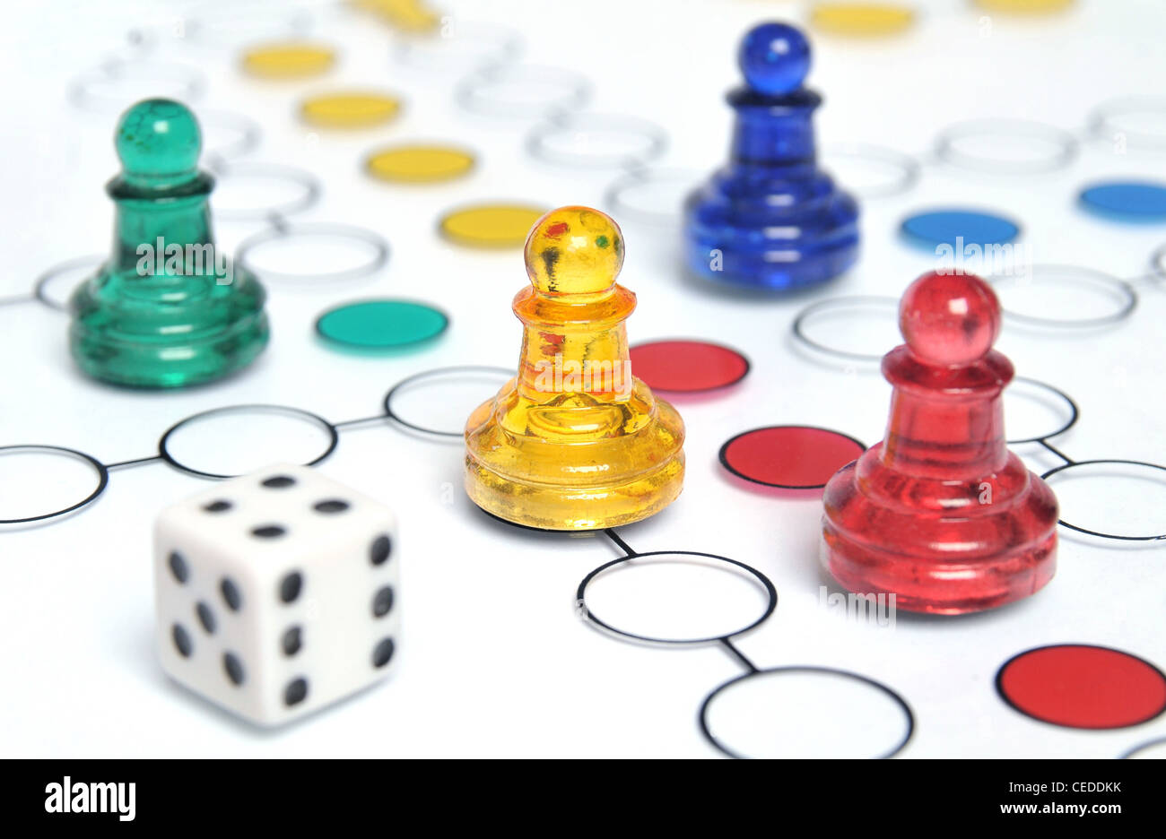 Ludo game with multicolored glass figures Stock Photo - Alamy