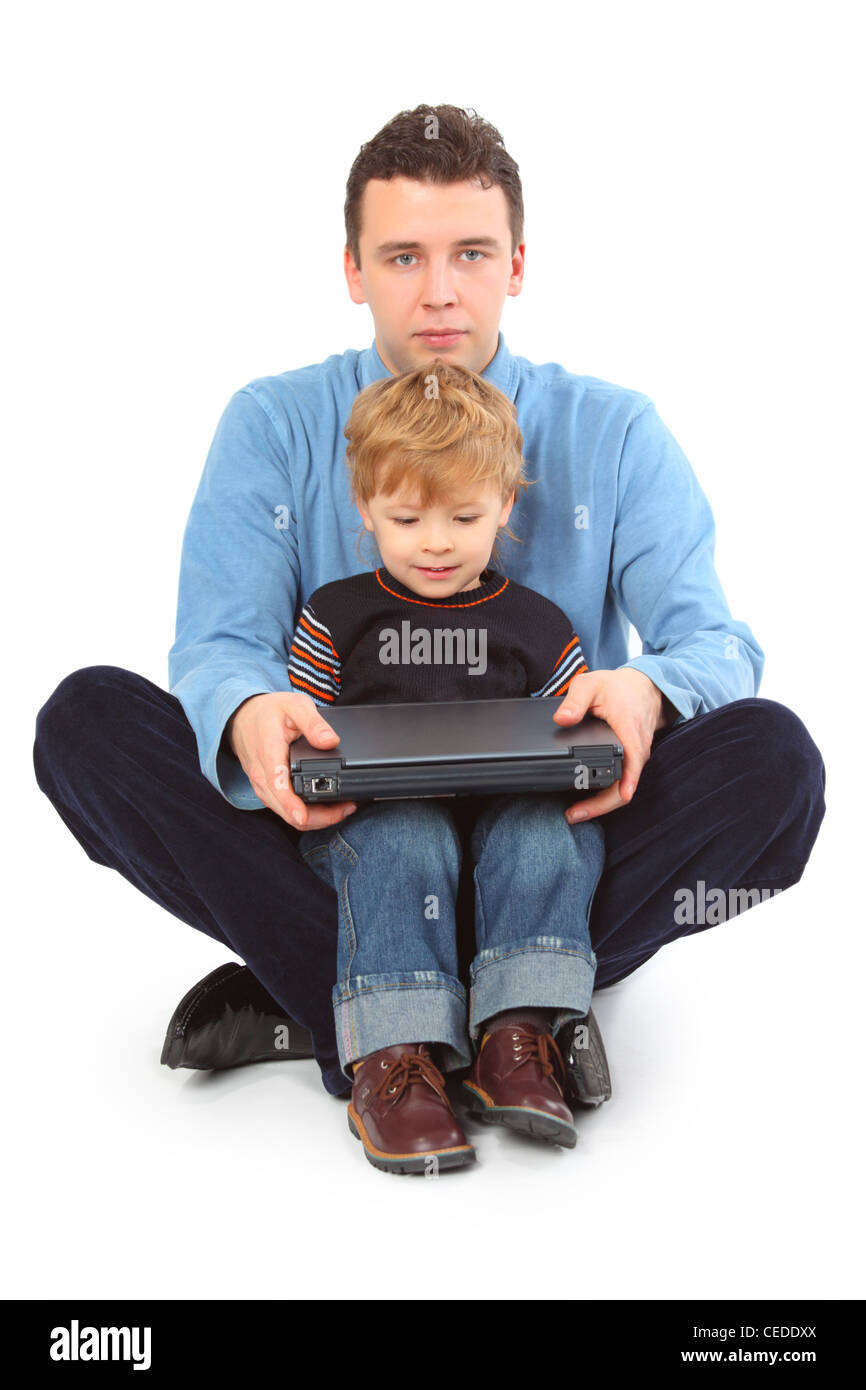 Father and son with laptop, father is afraid of Internet influence ...