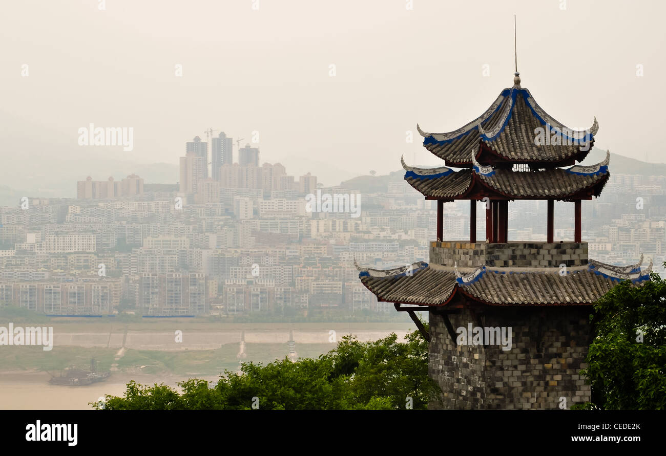 ancient chinese pagoda overlooking yangtze river against a modern ...