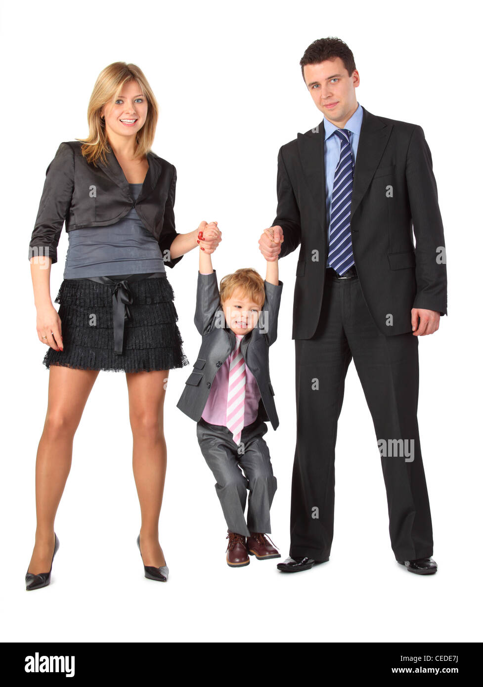 Parents hold son for hands, full body, business family Stock Photo - Alamy